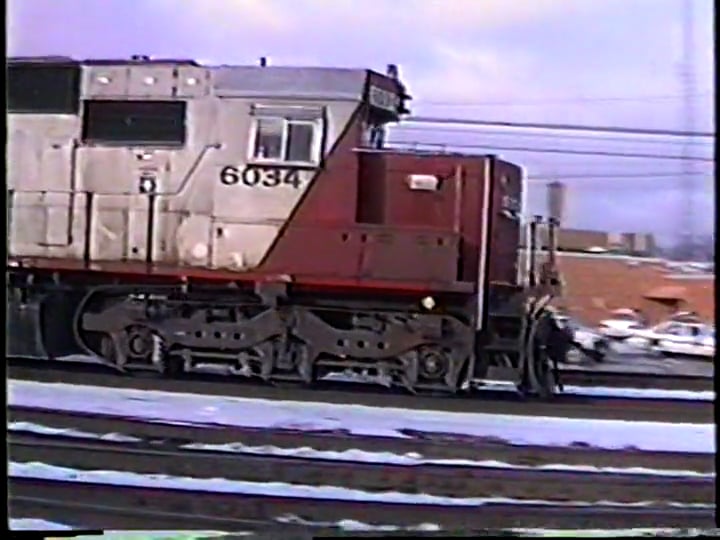 Soo Line. Soo 6034 East at Franklin 42Park, with leased SD40-2. 1/29/95. on Vimeo