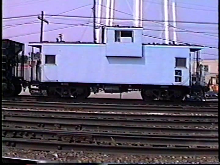 Metra work train with caboose. Franklin Park. 6/19/94. on Vimeo
