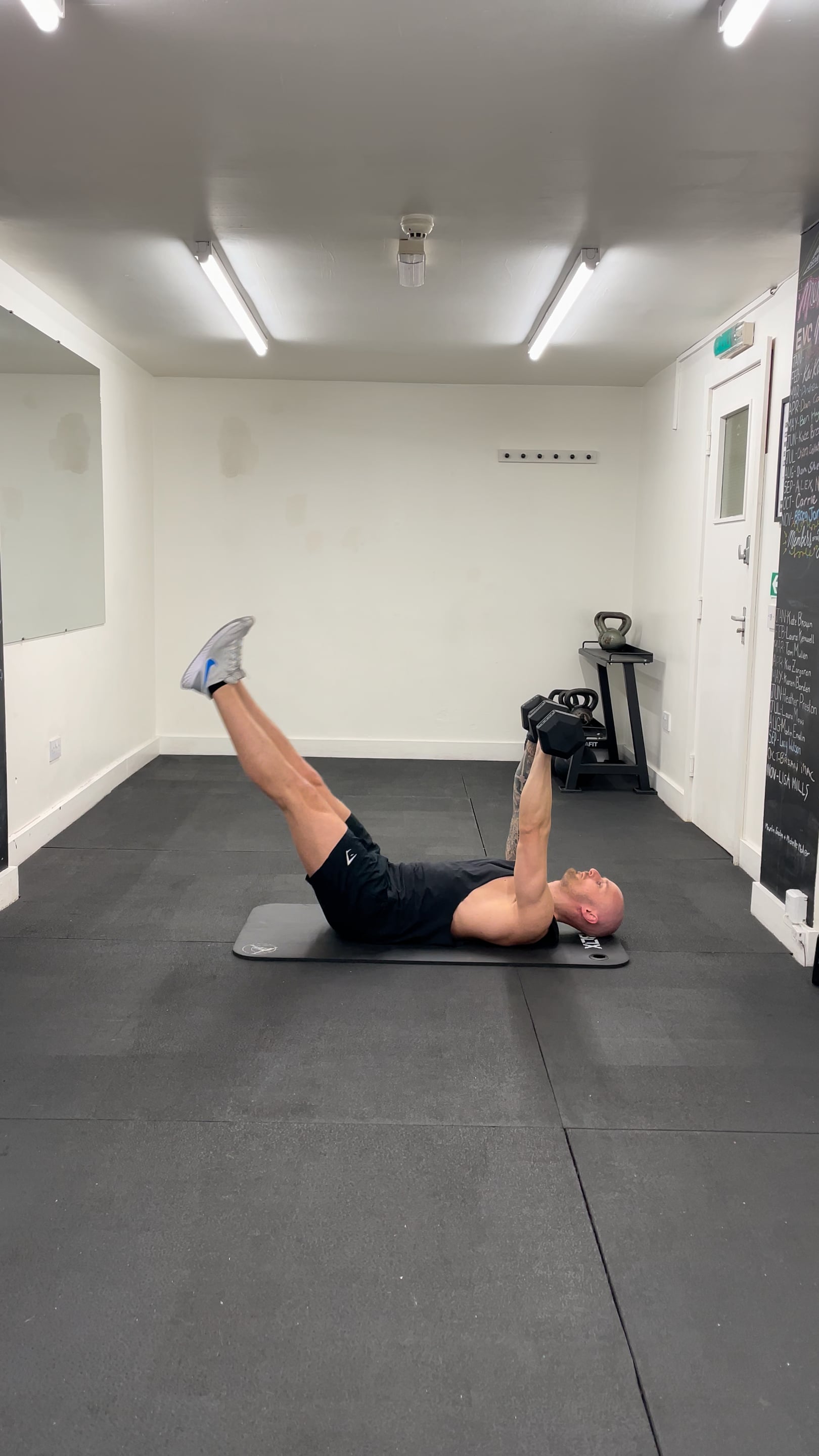 Lying Leg Raises (with DBs overhead).mov on Vimeo