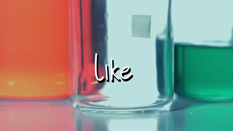 Animation of like text over beakers with liquid Video from Pikwizard