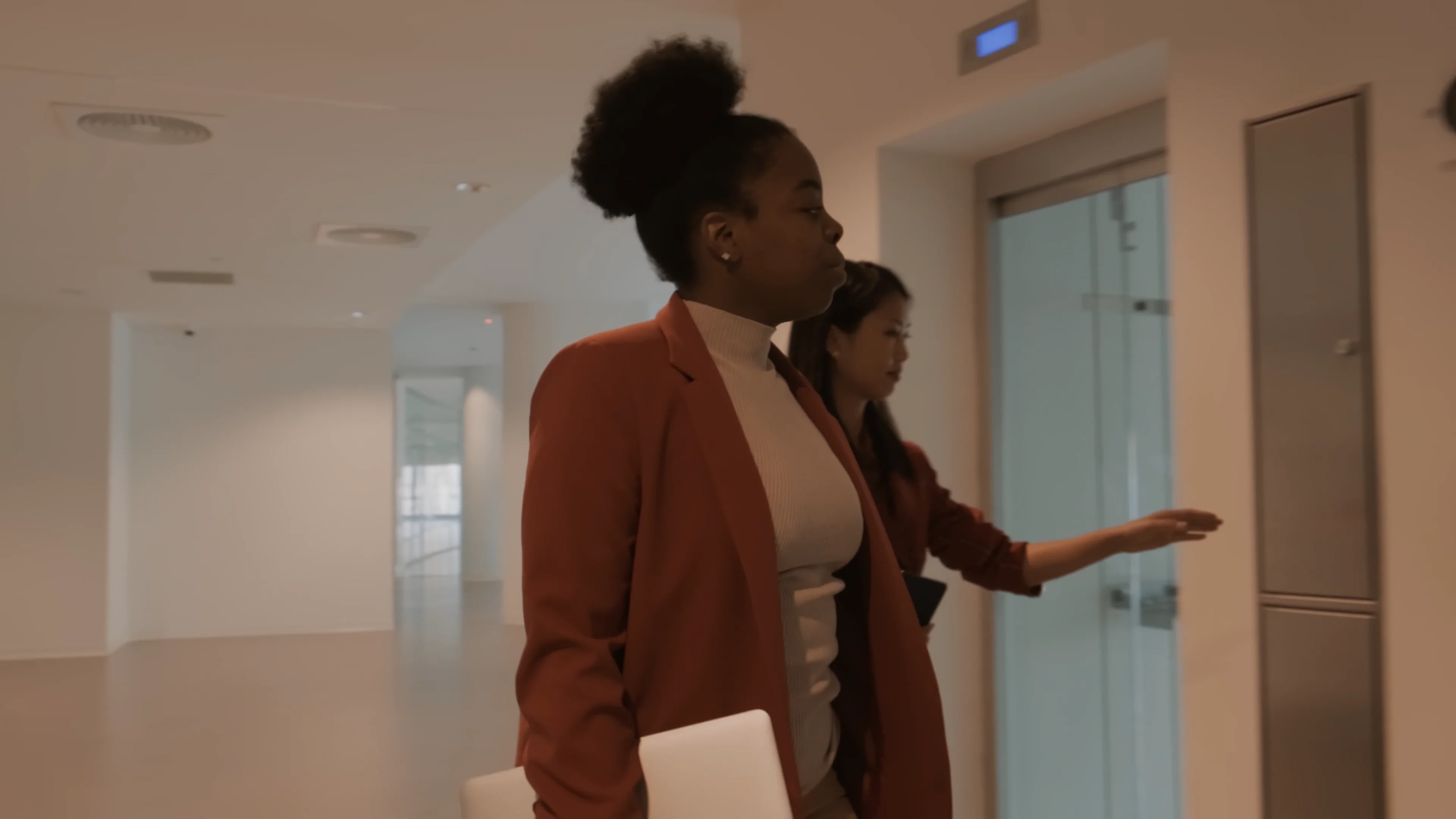 Two Women walk into elevator on Vimeo