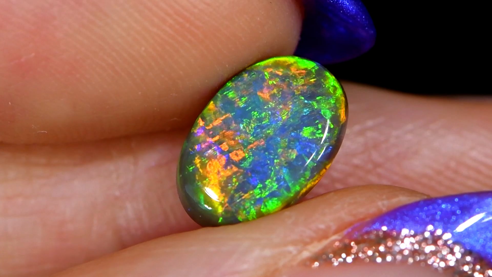 XX1144 Orange Yellow Green Fire Black Opal 1.35 ct on Vimeo