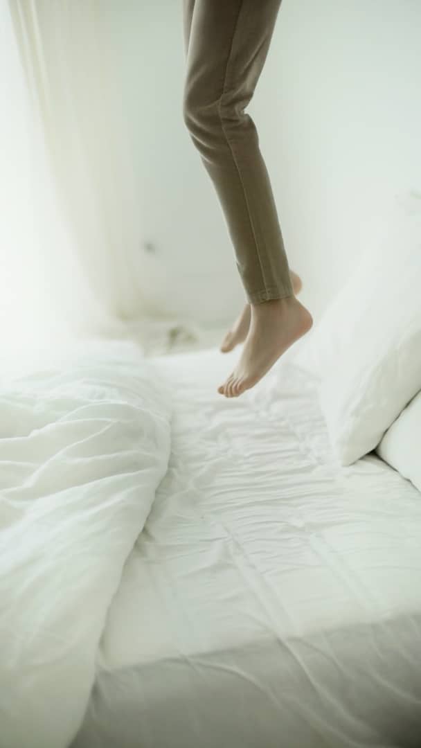 Woman Jumping on Bed on Vimeo