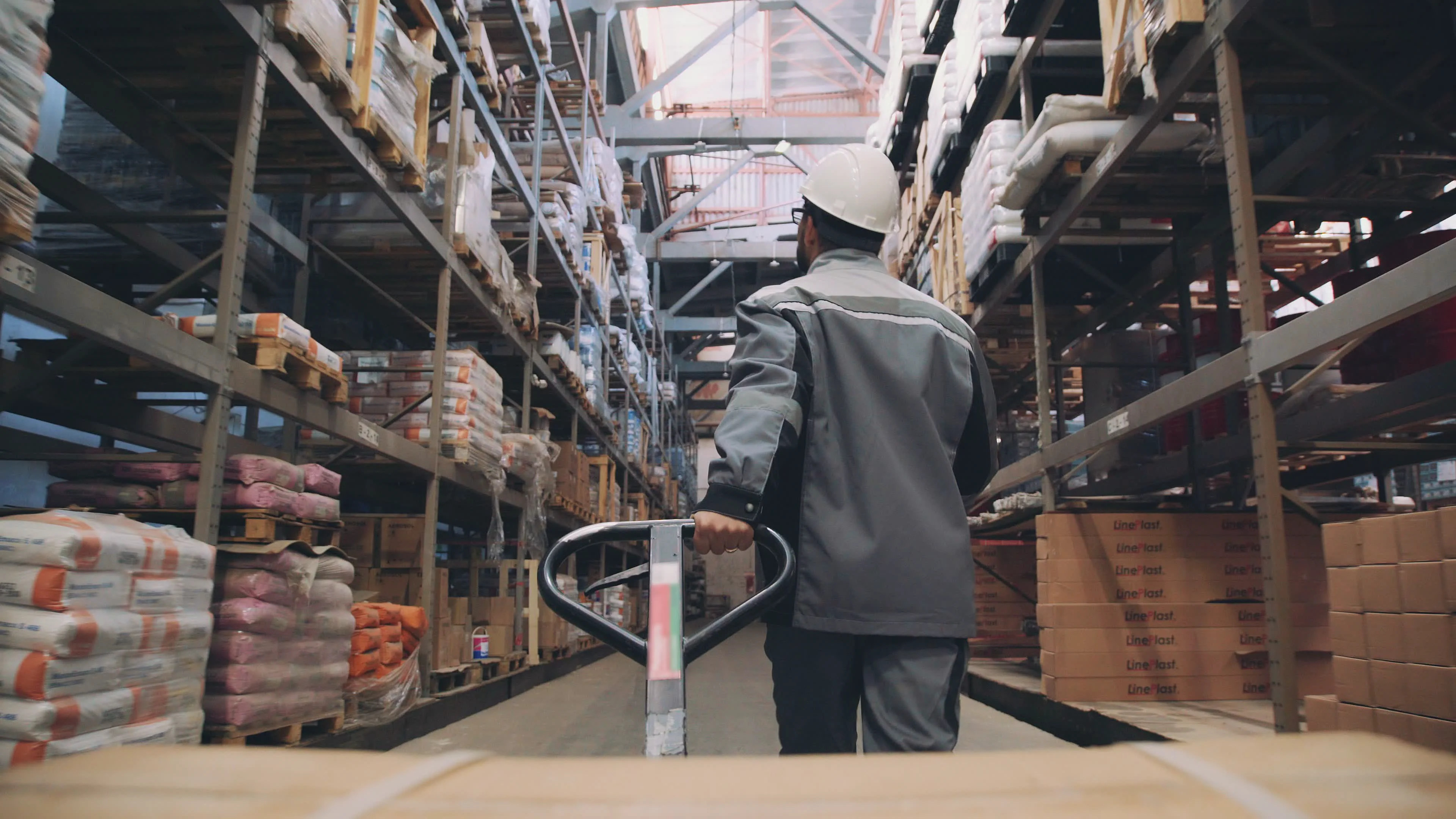 warehouse-worker-pulling-a-pallet-truck-shooting-2022-08-03-09-34-13 ...