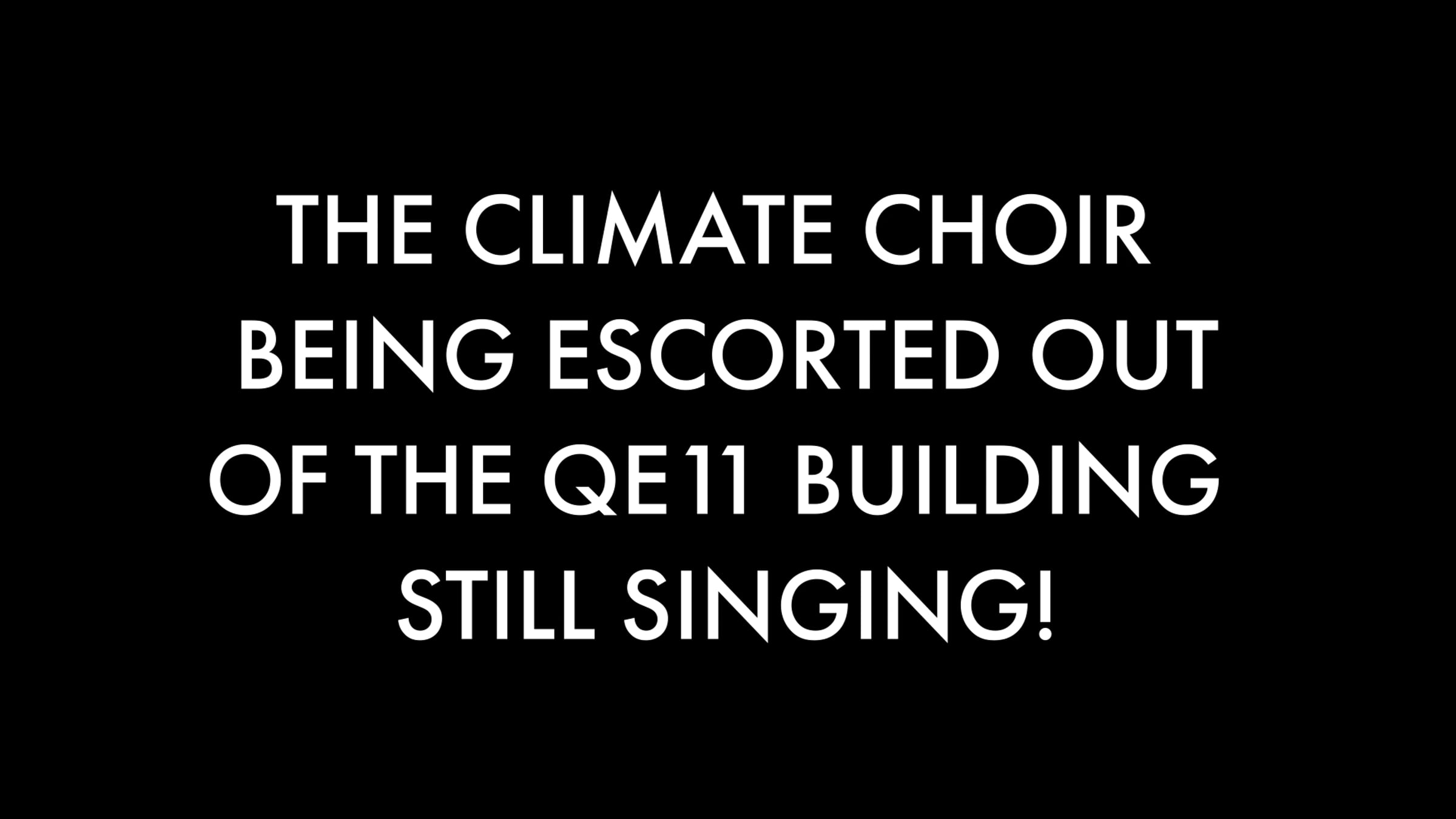 The Climate Choir being escorted out of the QE11 building still singing!