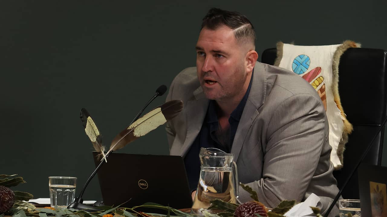 Yoorrook Commissioner Travis Lovett questions the Minister for Police ...