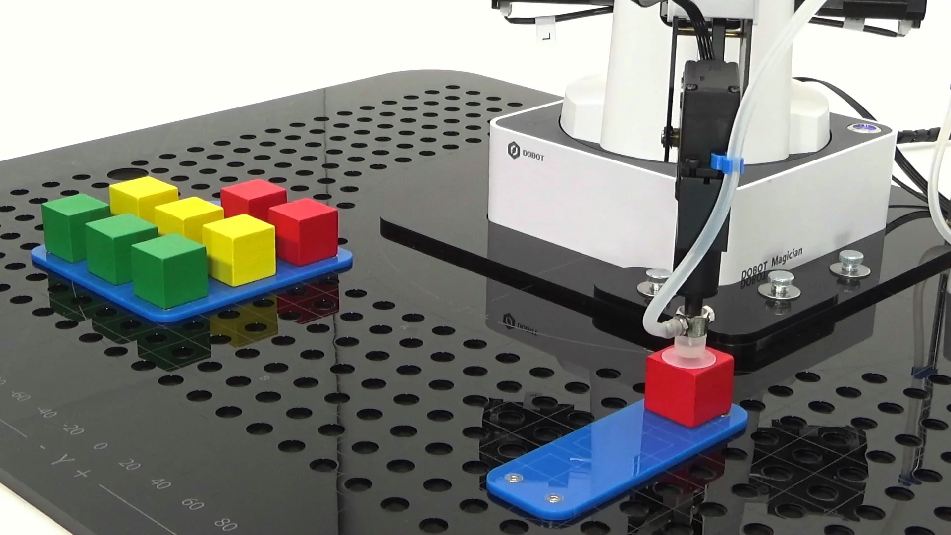 Dobot Magician basics - 18 Moving 9 cubes and stack them. on Vimeo