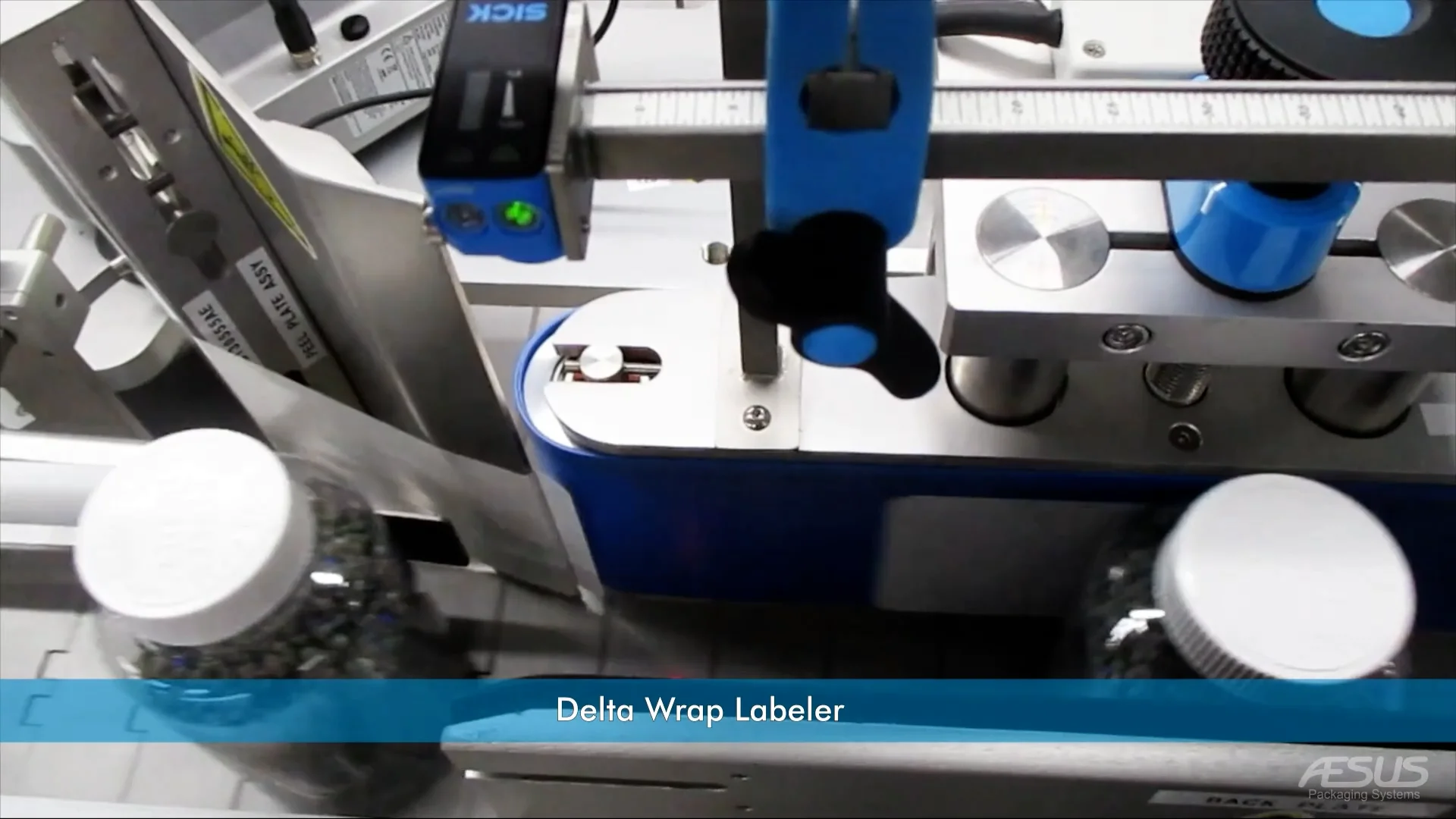 Aesus Delta Wrap labeler with bottle separator & Chain aligner on Vimeo