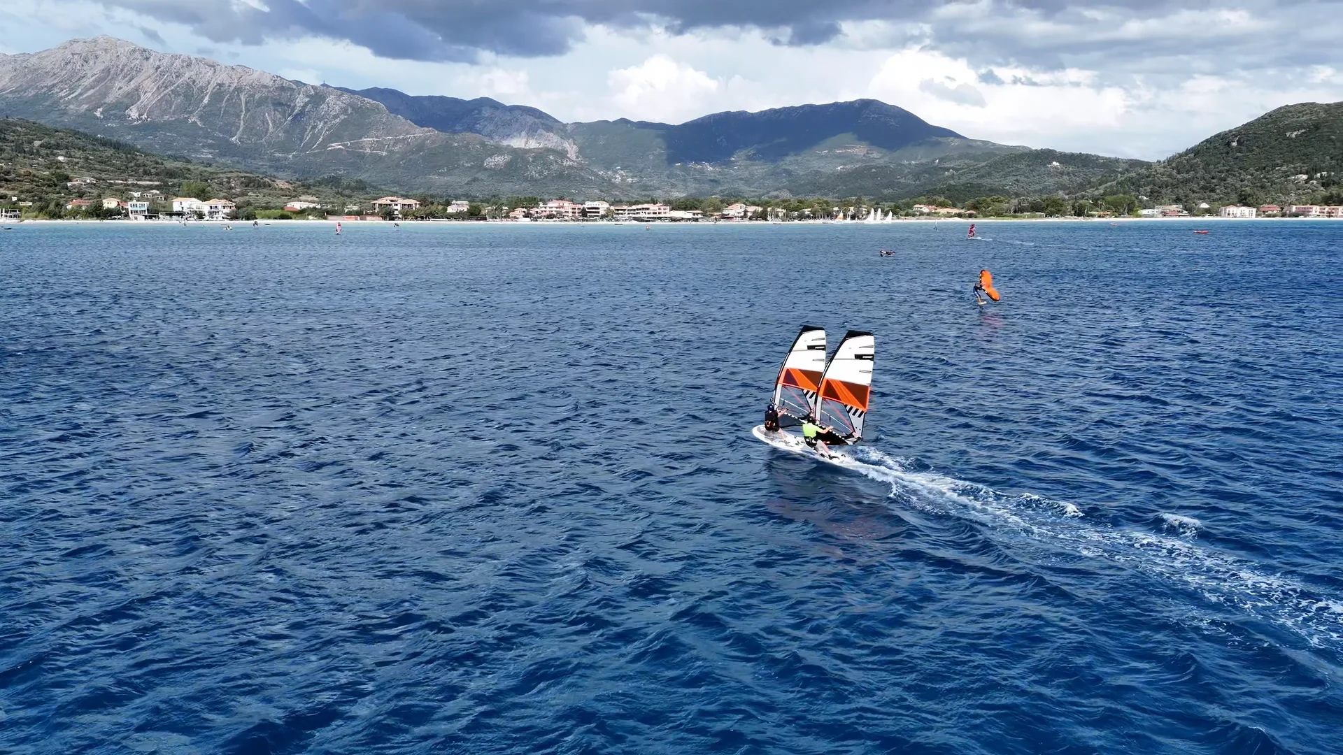 Mike and Fiona windsurf tandem carve gybe 2023