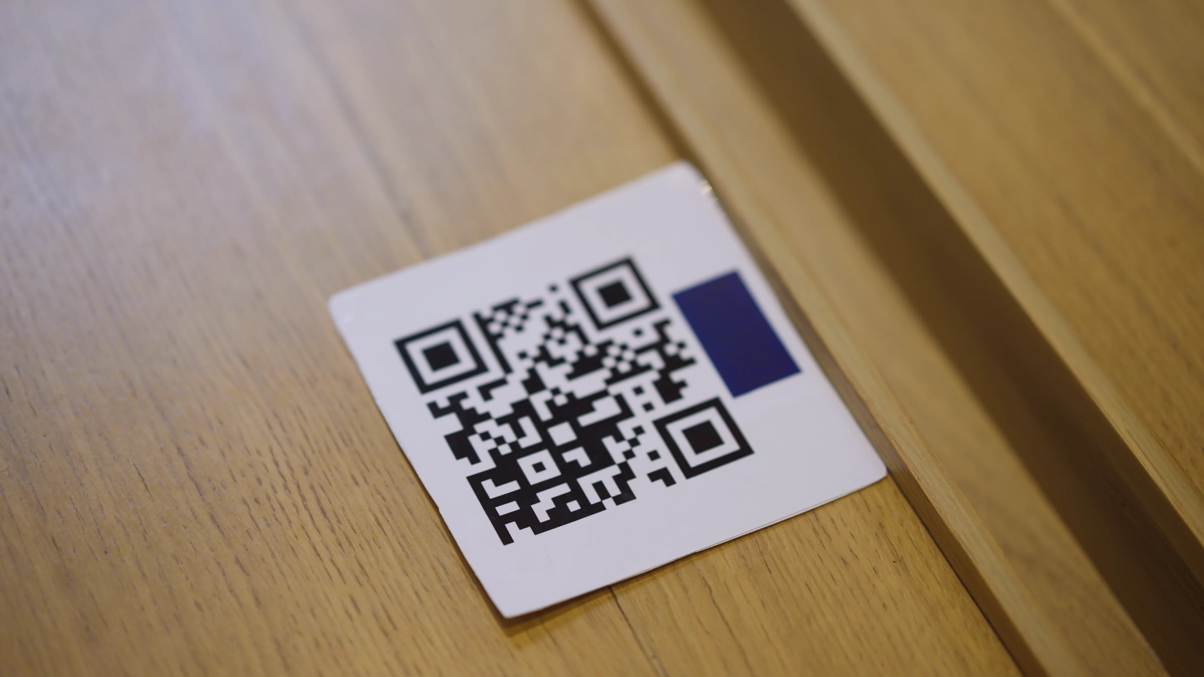 closeup-qr-code-on-table-with-female-hand-scanning-2022-08-10-08-45-24 ...