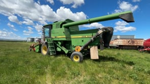 John Deere Titan II 7720 Combine, w/ 272 pickup header - Ascent Auction