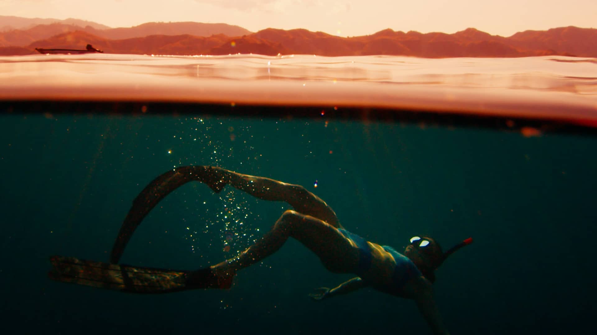 Woman_Freediver_Swims_Underwater_In_The_Sea_At_Sunset_And_Relaxes_And_Floats_Ben_fhd_2598520 on ...