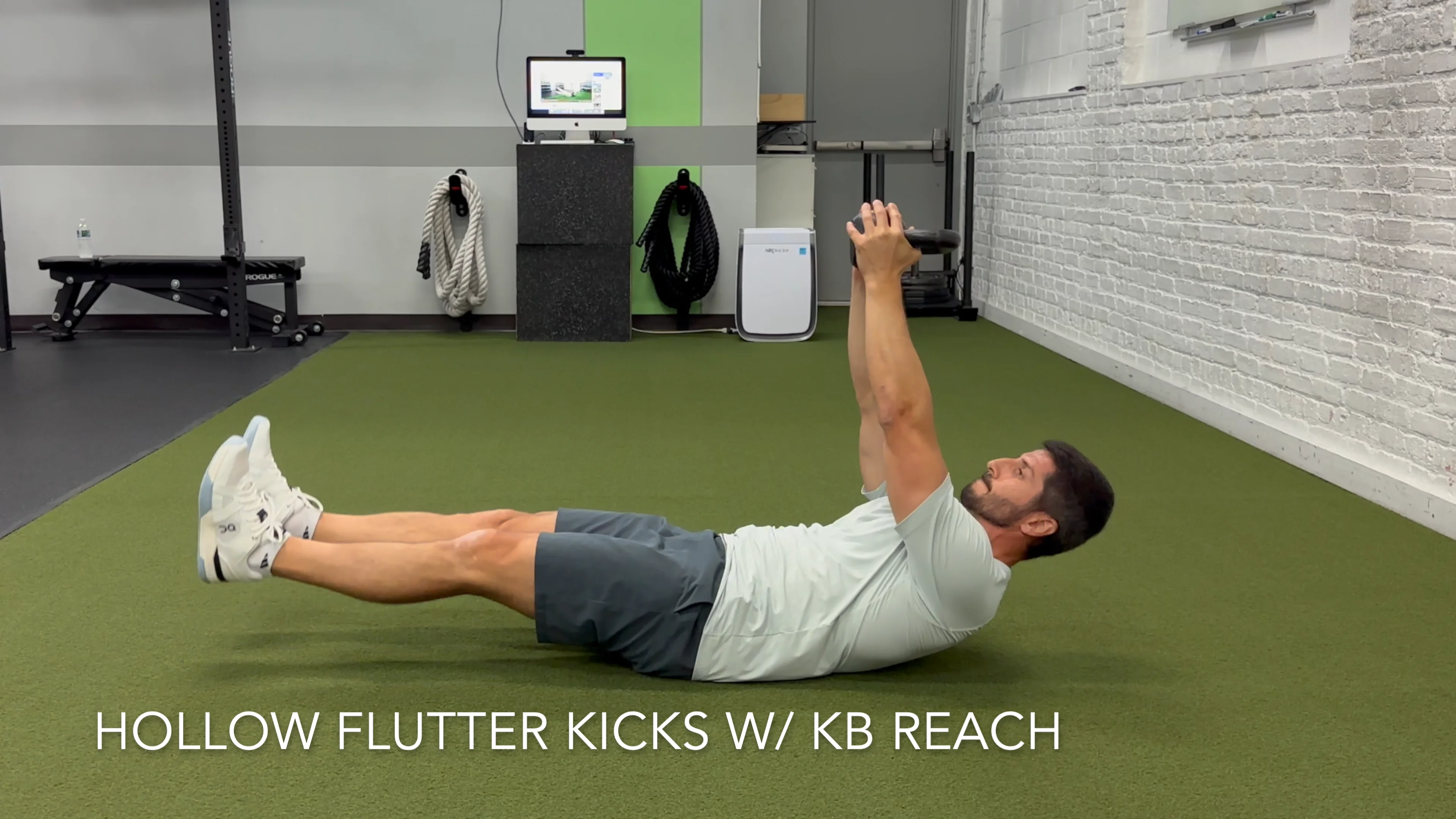 Hollow Hold Flutter Kicks w/ KB Reach