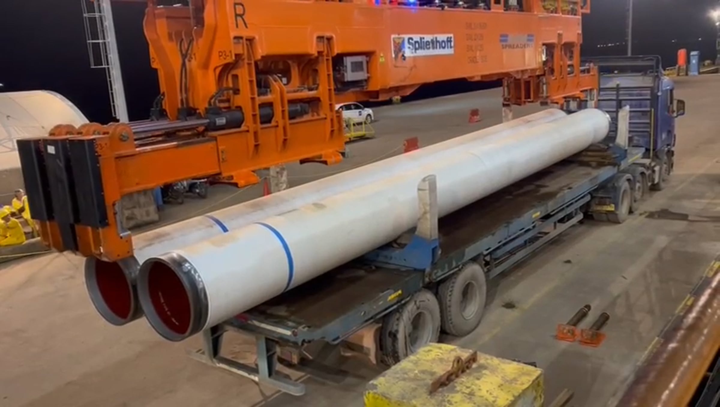 RAM pipe handling spreader working through the night