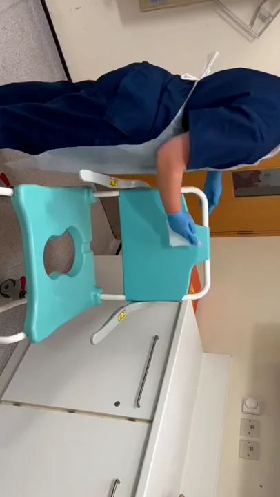 6 Begin cleaning the commode, starting with the back rest