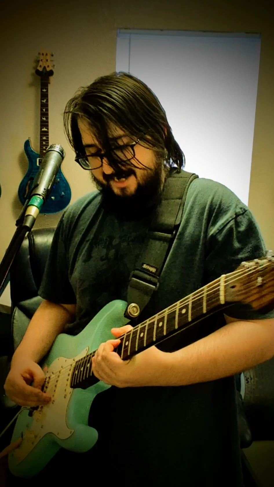 Ian Pugh-playing the guitar