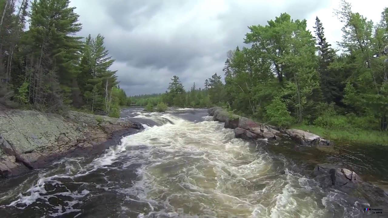 Waterfall on Wanapitei river. Y6 multirotor aerial filming over the ...