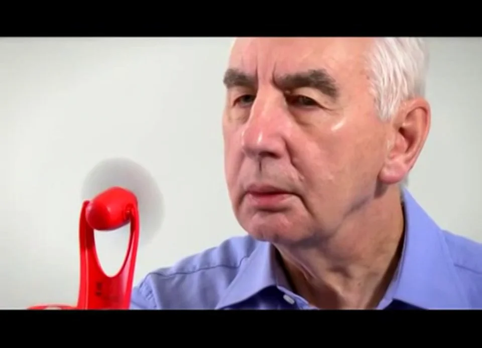 Using a handheld fan to reduce breathlessness