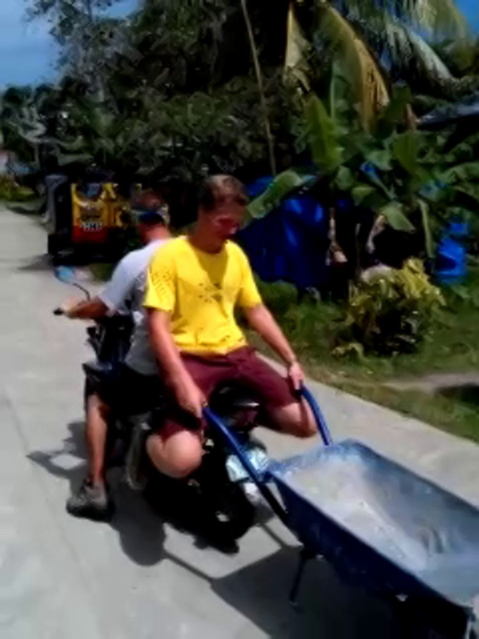 How to carry a wheel barrow on a motorbike Filipino style on Vimeo