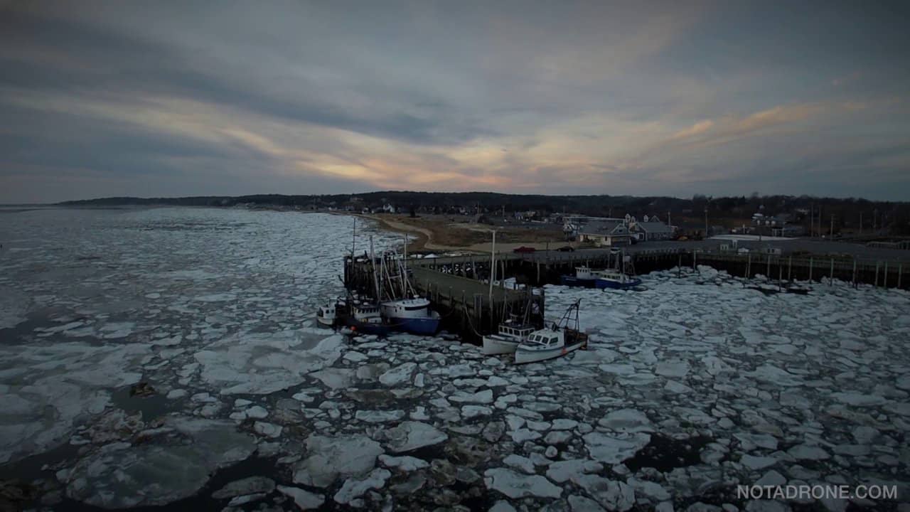 Frozen Harbor: Aerial video of frozen ocean harbor in Wellfleet, Cape ...