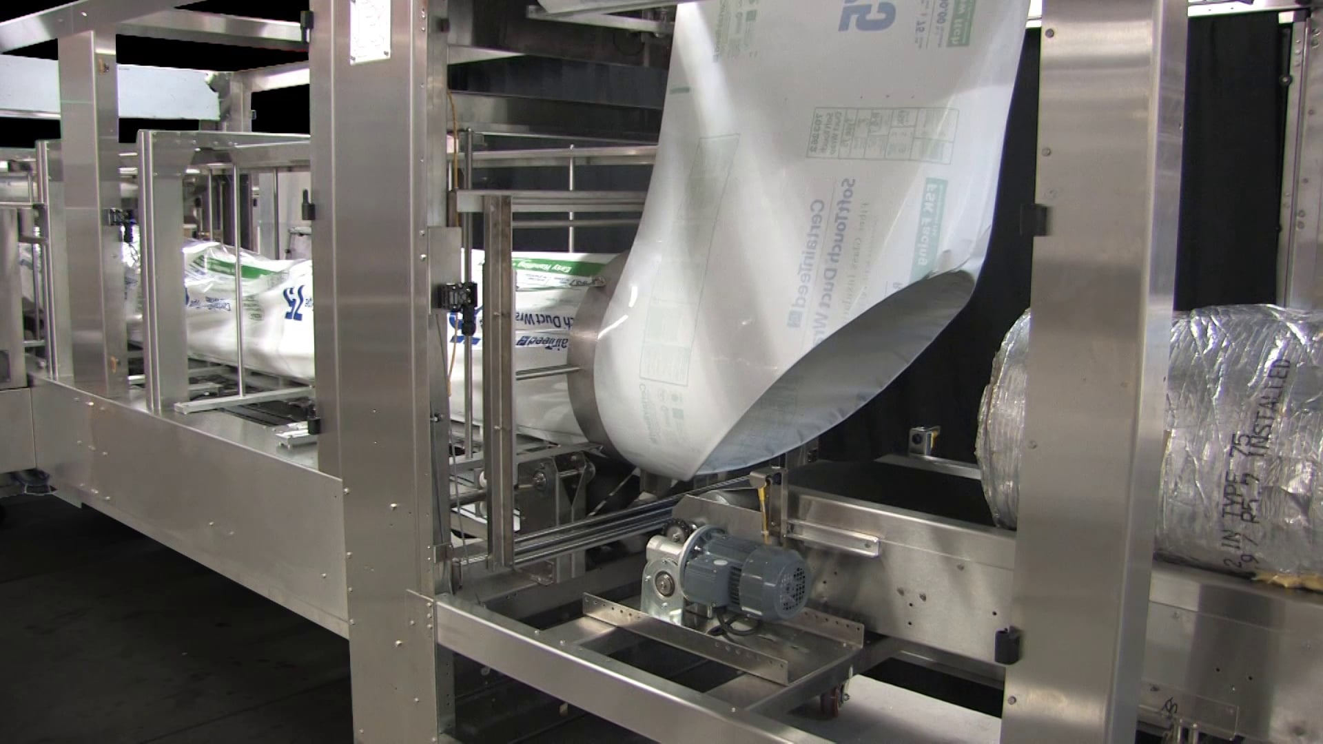 3569-Bagging Machine for Large Rolls of Insulation on Vimeo