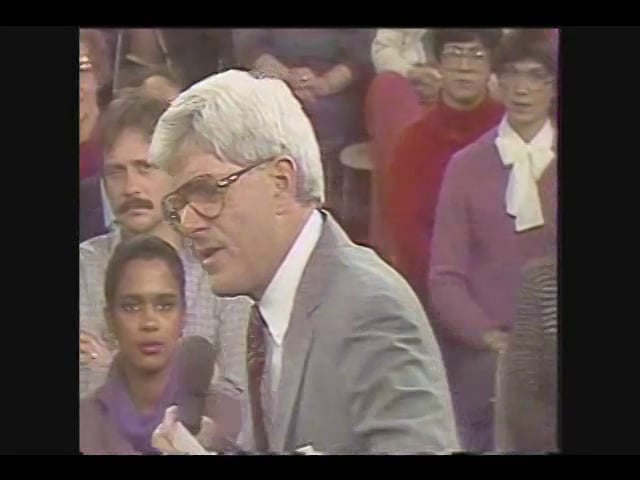 Paul Farkas fitting lenses on Donahue show on Vimeo