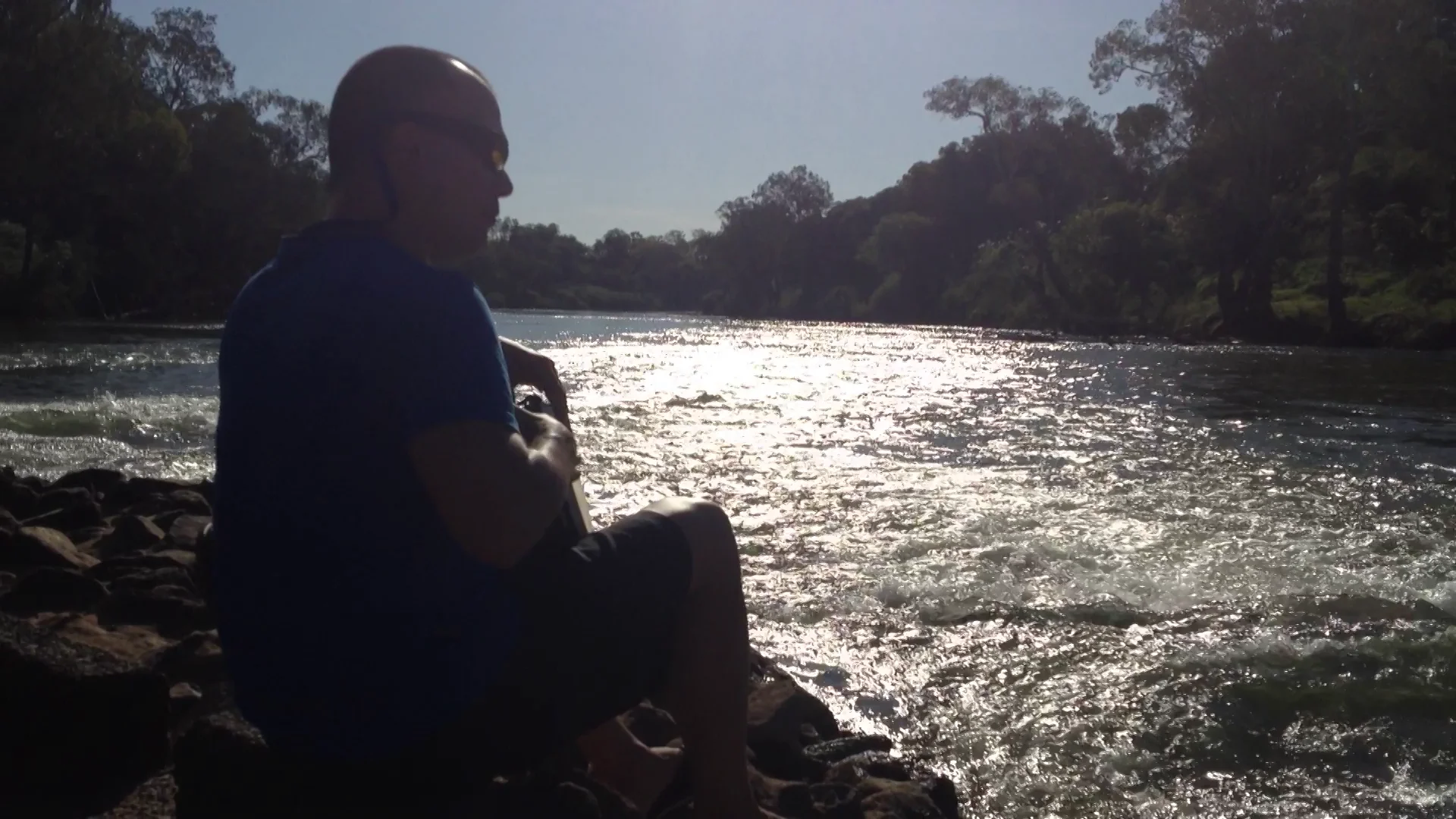 Ash Dargan playing drum on the Daly River