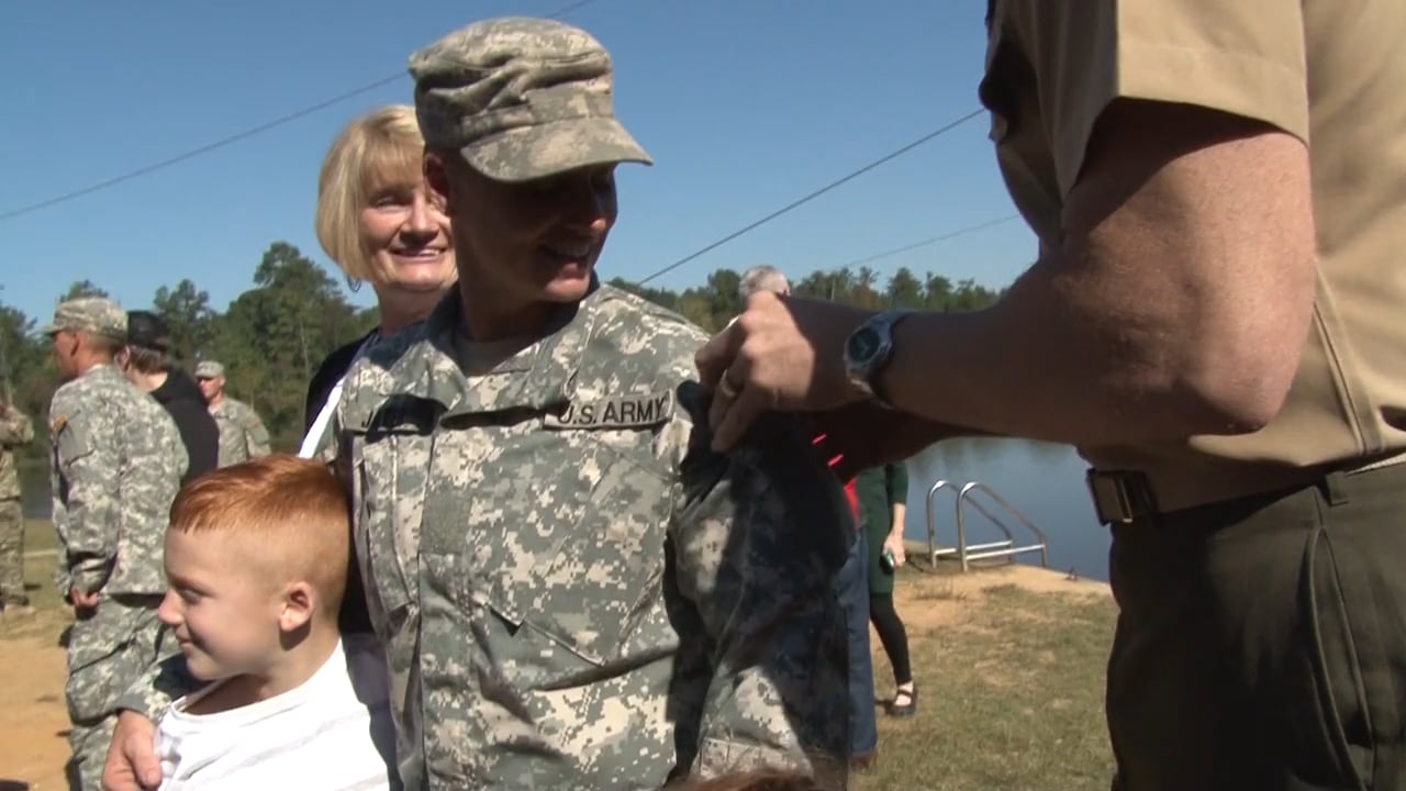MAJ Lisa Jaster's husband pins Ranger Tab on her shoulder on Vimeo