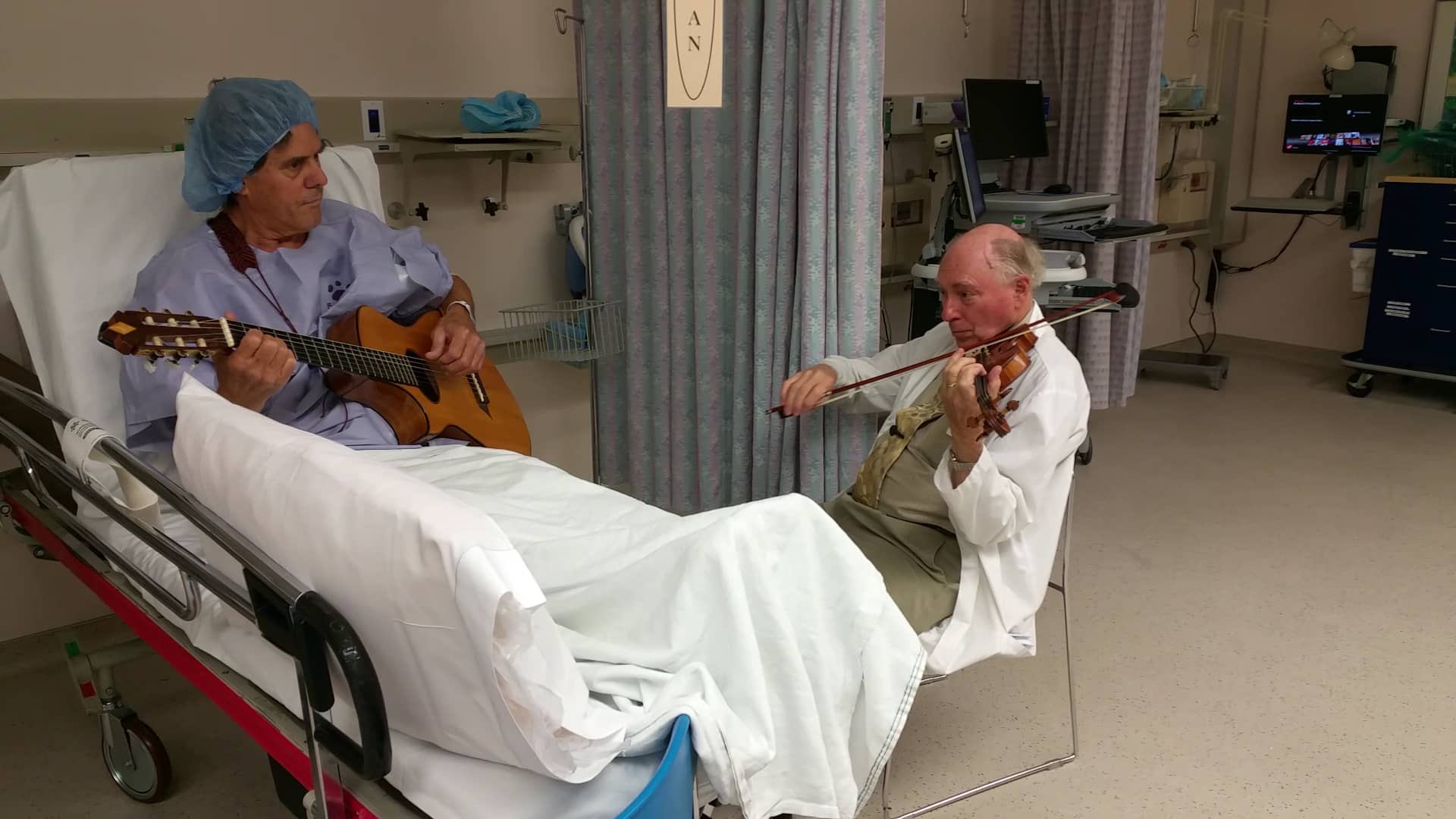 Dr. Sloan and Patient - Performing a Soothing Duet Before Surgery on Vimeo