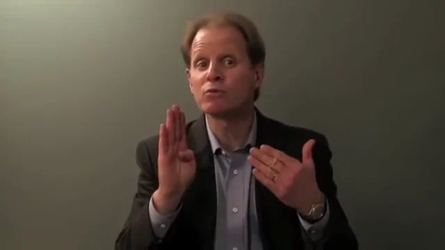 Dr Daniel Siegel presenting a Hand Model of the Brain