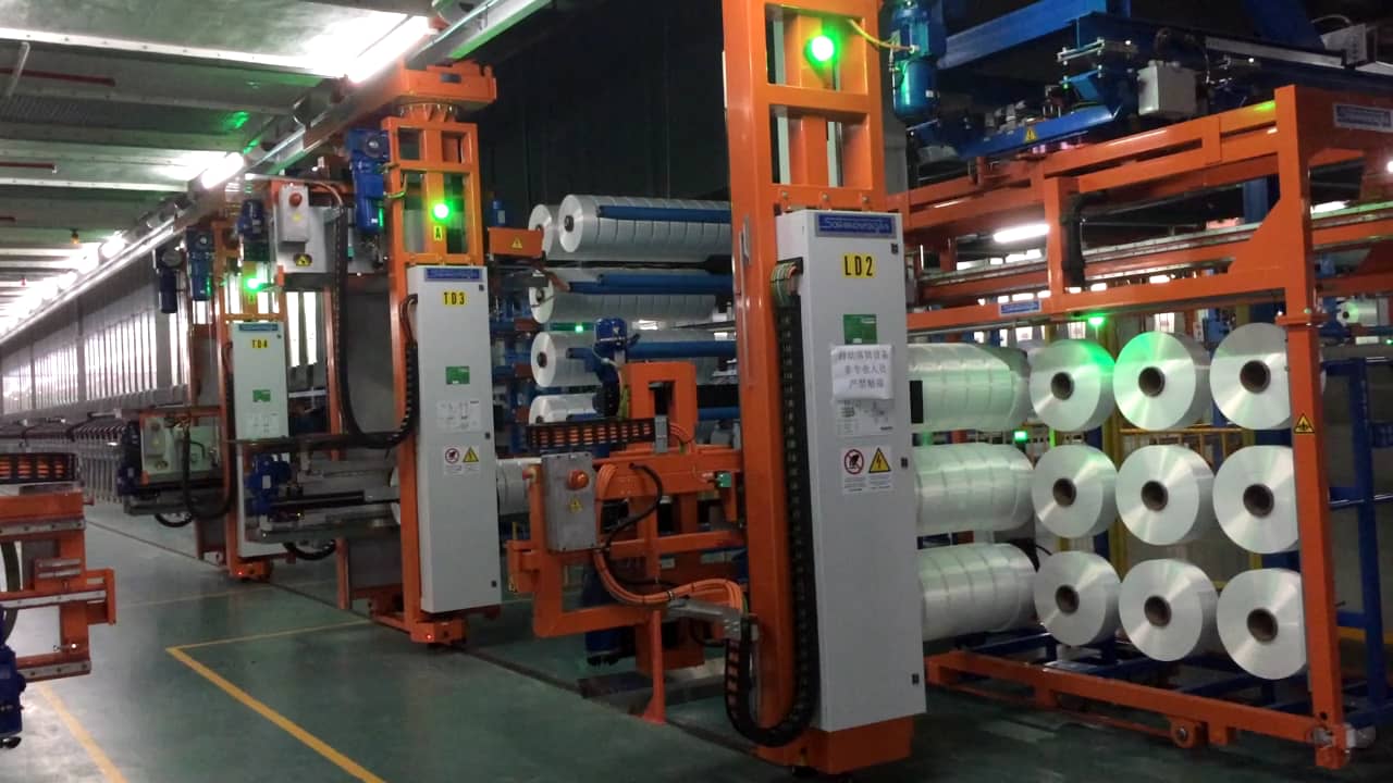 Bobbin doffing and packing system for large polyester plant on Vimeo