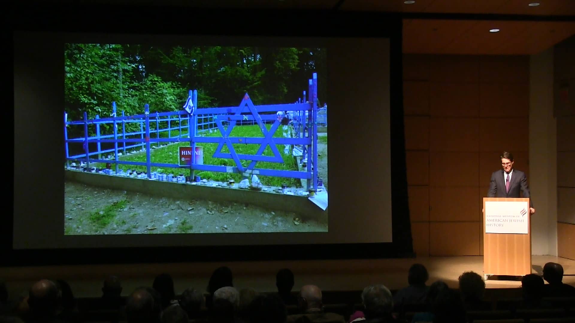 Bruce Gendelman speaking at opening reception of "Sifting Through Ashes ...
