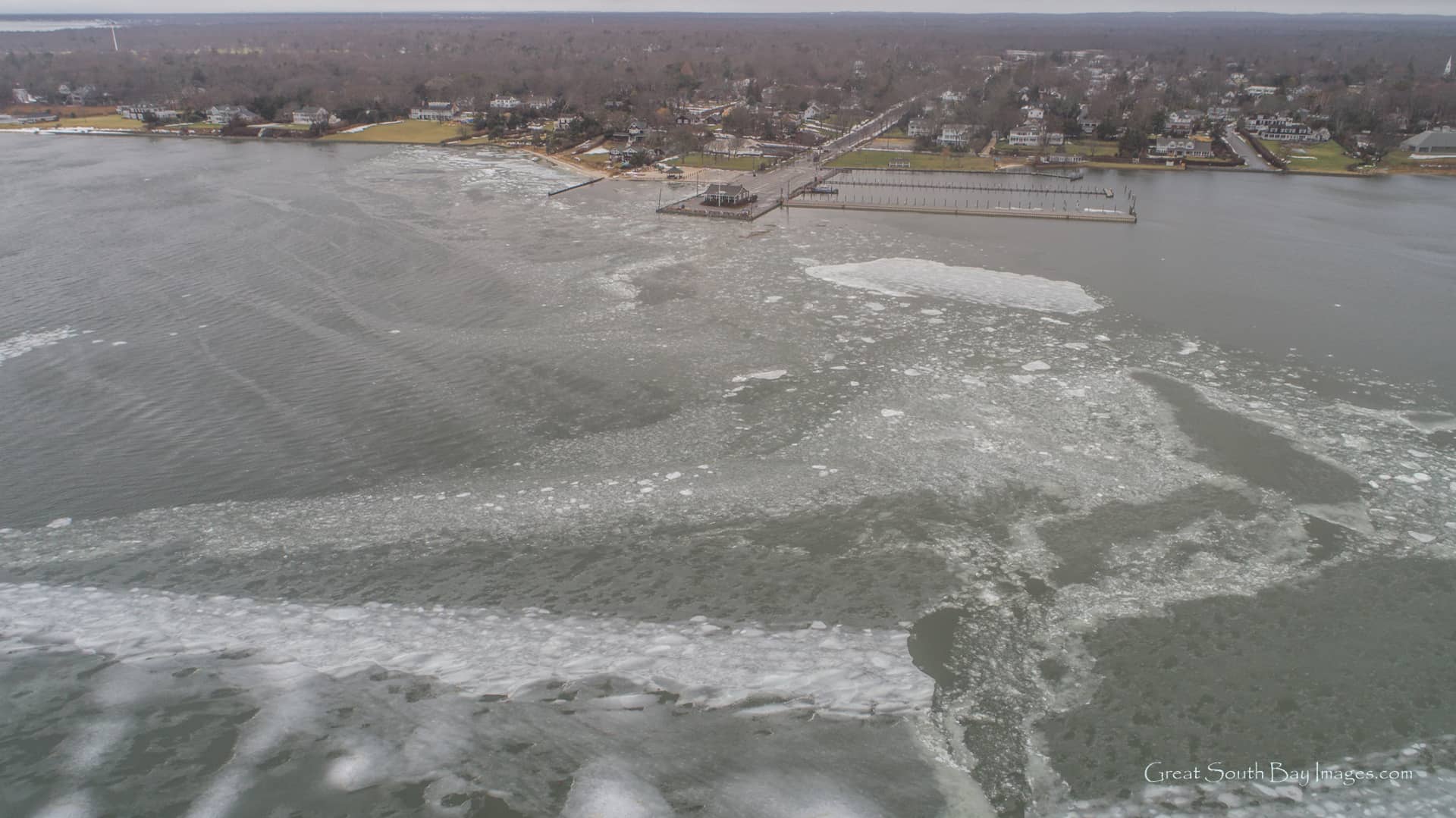 Drone over Ice flowing Past Bellport Dock on Vimeo