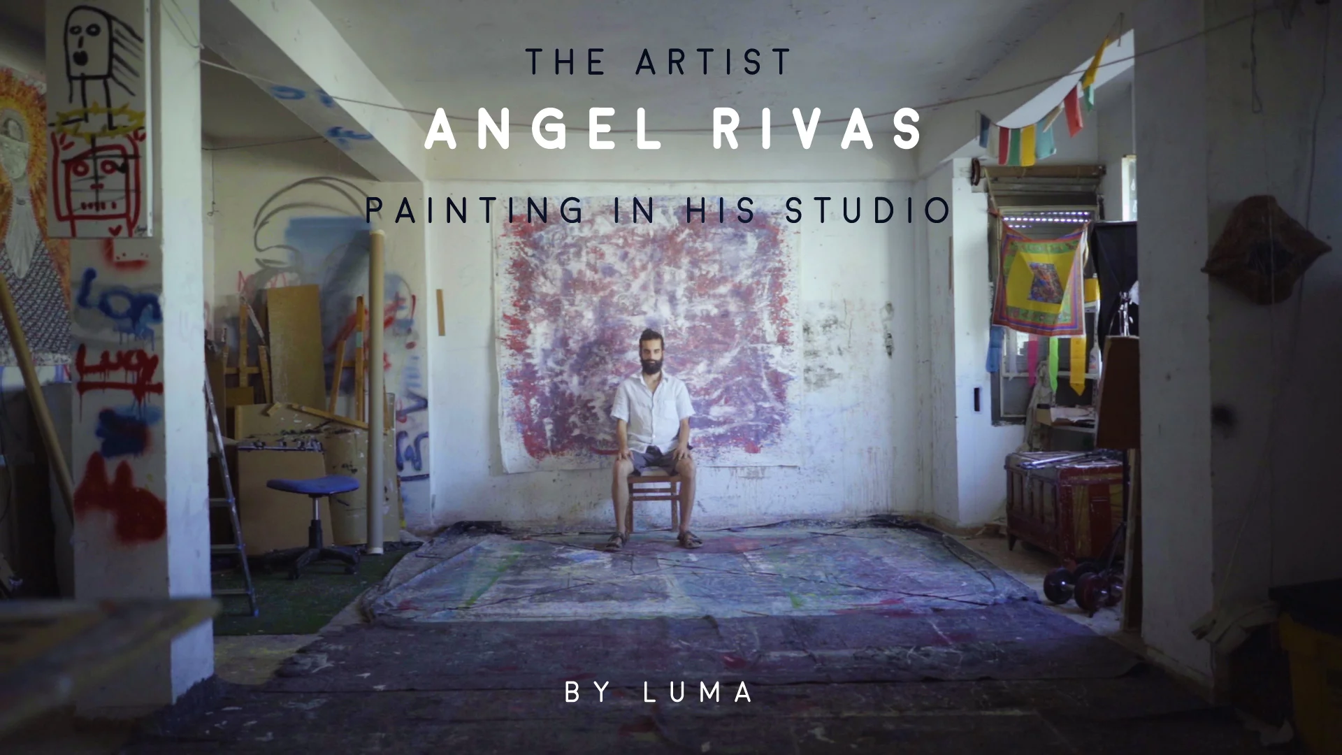 The artist Ángel Rivas painting in his studio