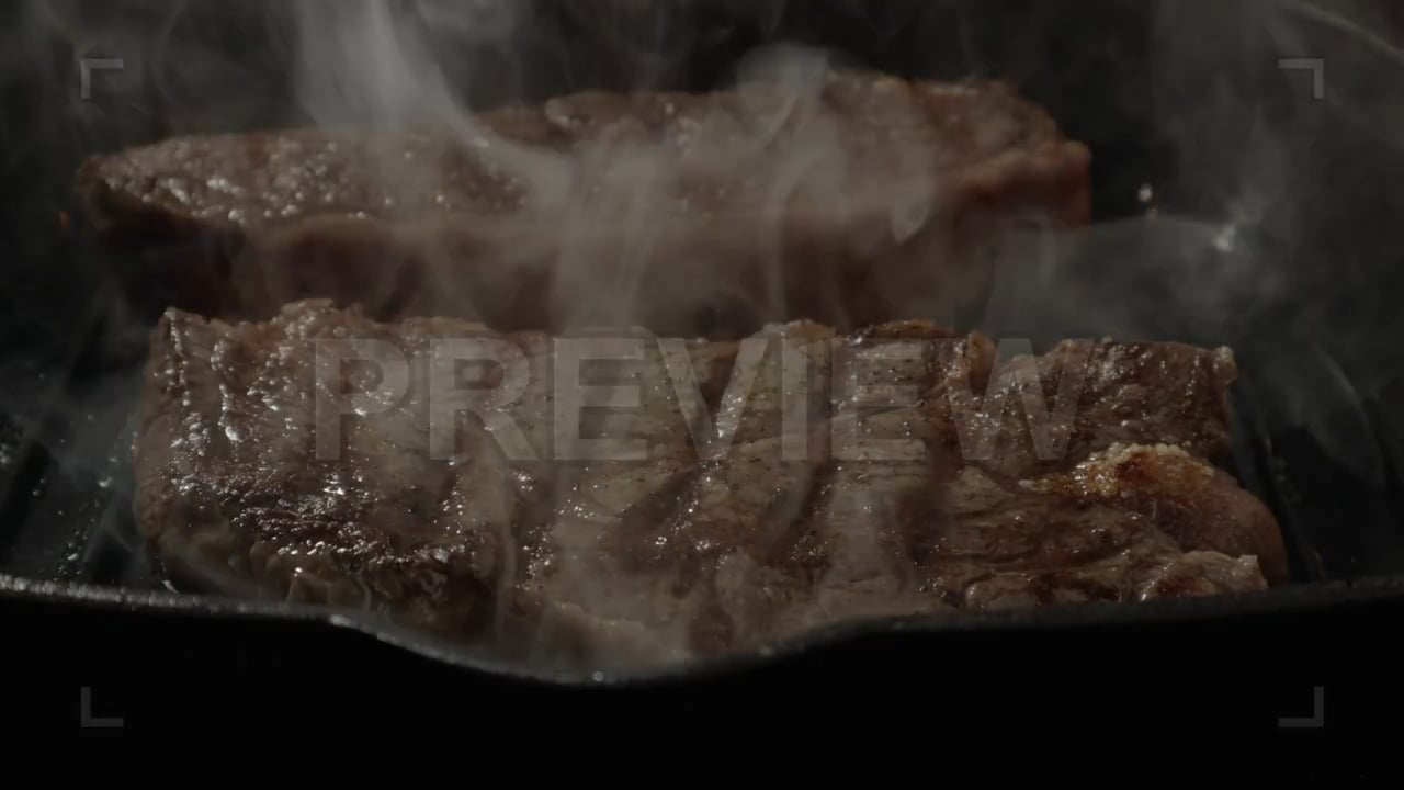 Flipping Beef Steaks Stock Video on Vimeo