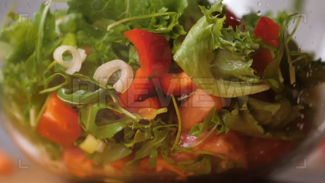 Salad Dropping Into Bowl Stock Video on Vimeo