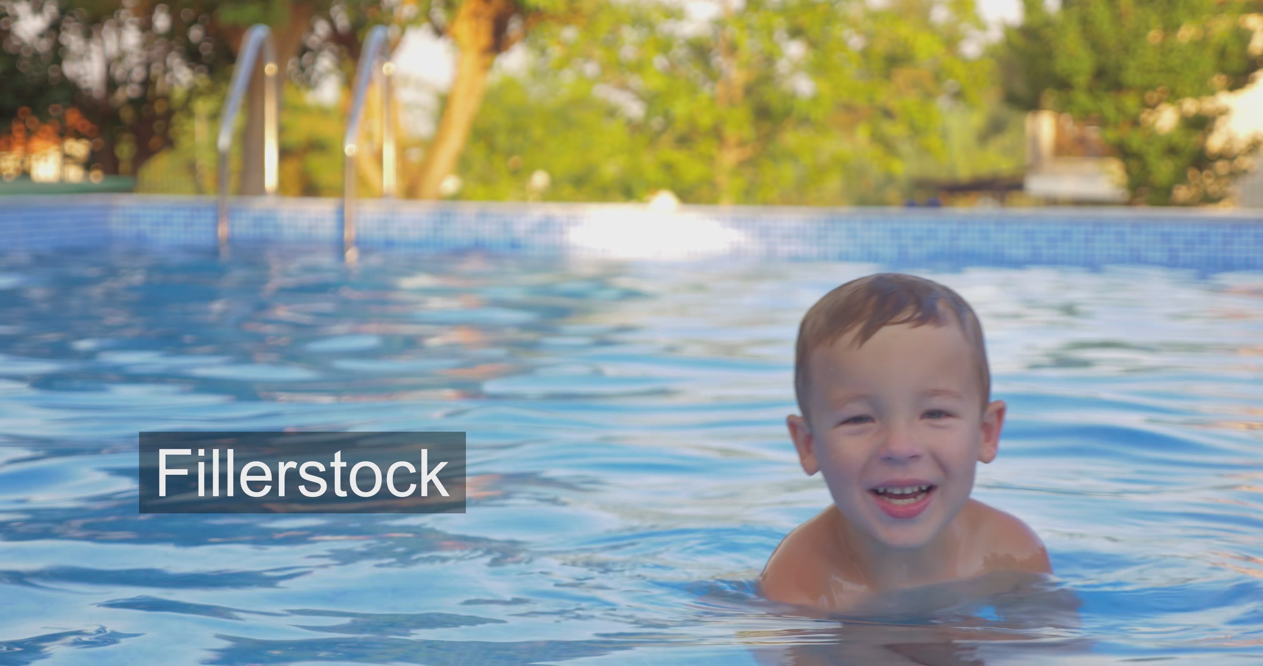 Cute little child bathing in outdoor swimming pool on Vimeo