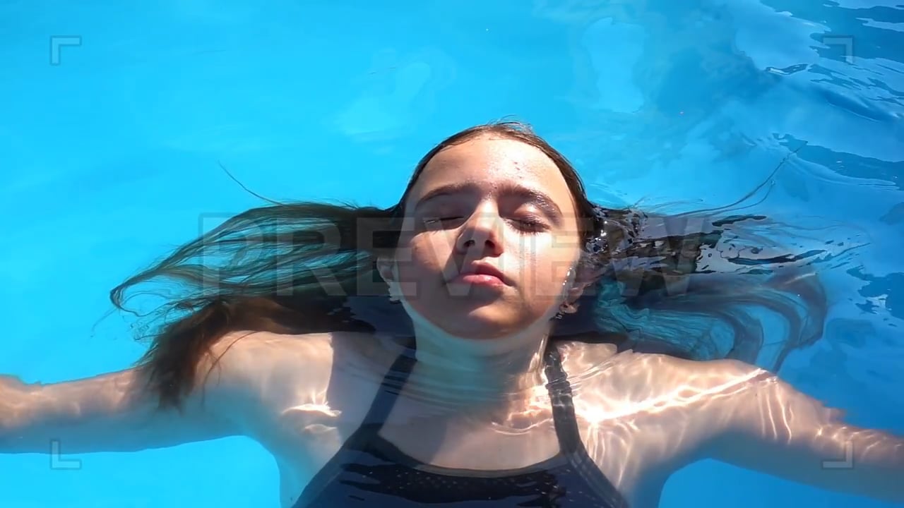 Floating In A Pool Stock Video on Vimeo